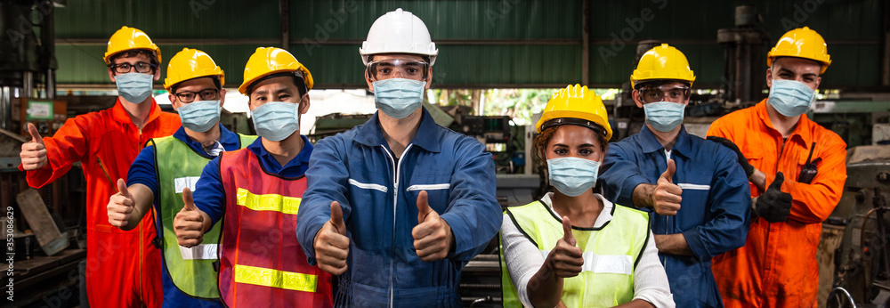 Group of Worker wearing face shield or disposable face mask work in ...