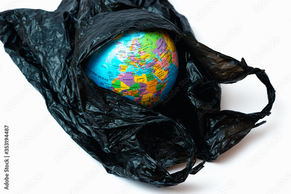 World Globe inside plastic bag you can see in hole different parts of ...