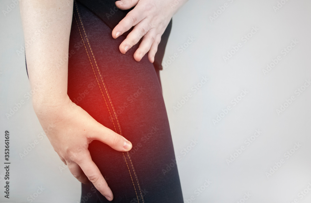 A woman suffers from pain in the outer thigh. The concept of treating a ...