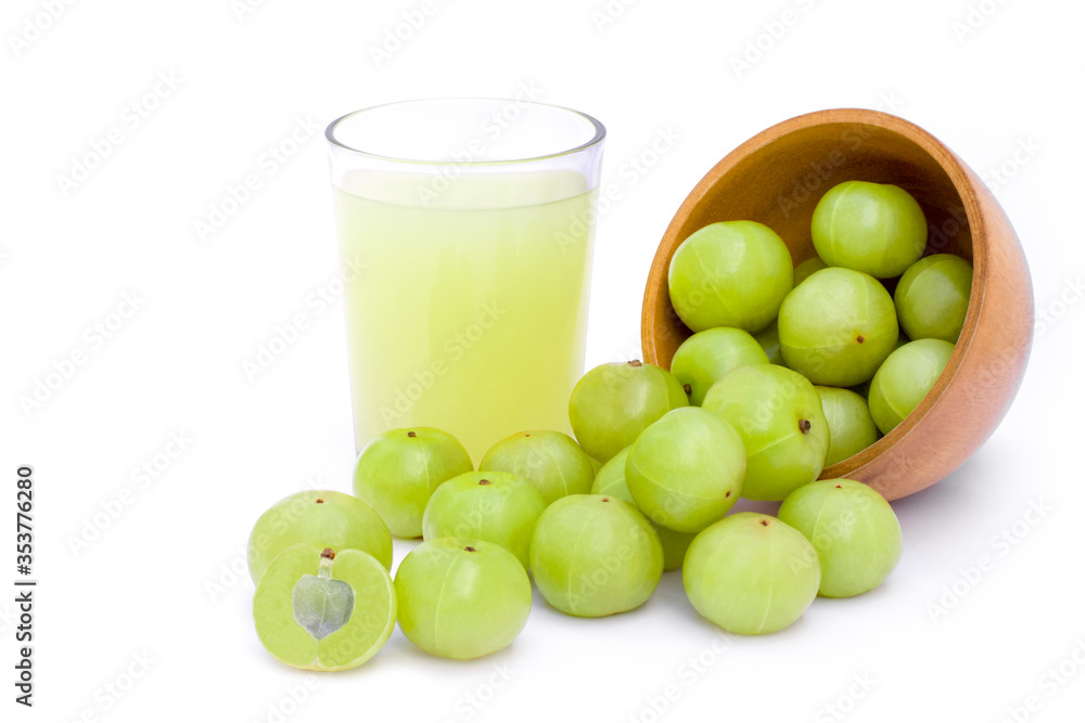 Closeup fresh organic Indian gooseberry fruits ( Amla ) in wooden bowl ...