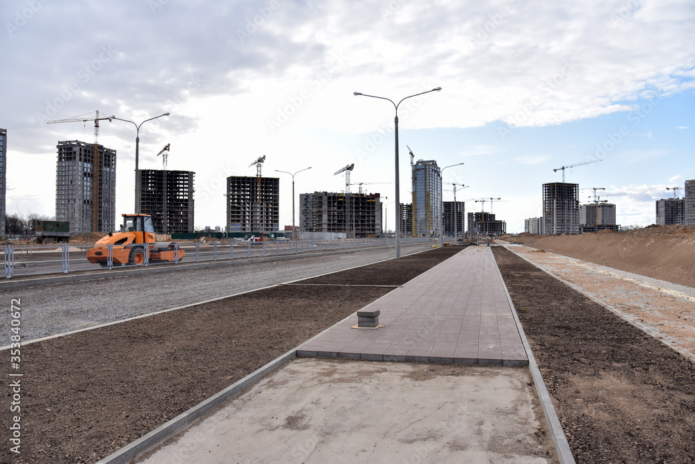 Laying paving slabs at construction site. Process of installing paving ...