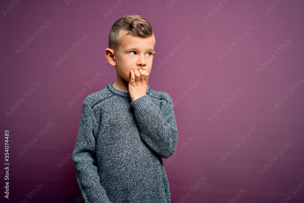 Young little caucasian kid with blue eyes wearing winter sweater ...