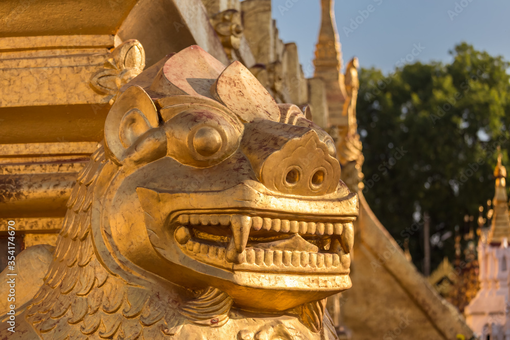 Statue of guardian lion chinthe in Shwezigon paya, Bagan, Myanmar ...