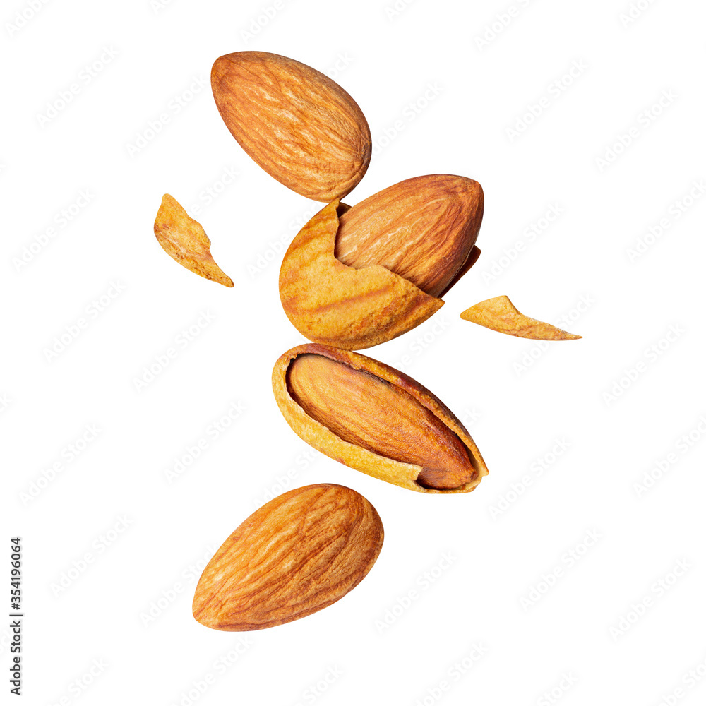almond pieces Broken shell nut Flying with nut clipping path on white ...