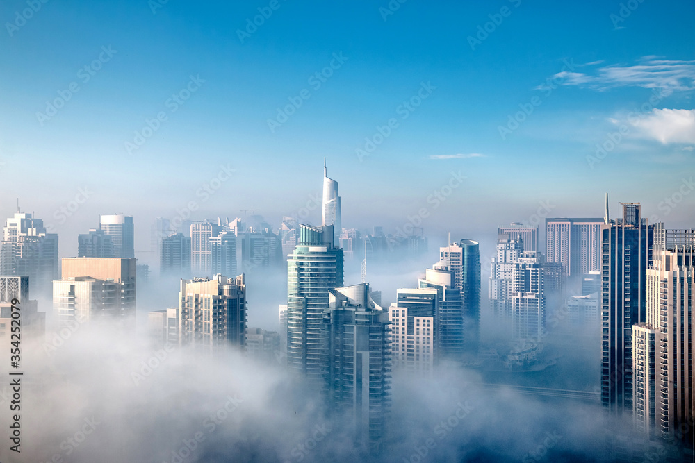 Dubai skyline, aerial top view of the city in Dubai Marina on a foggy ...