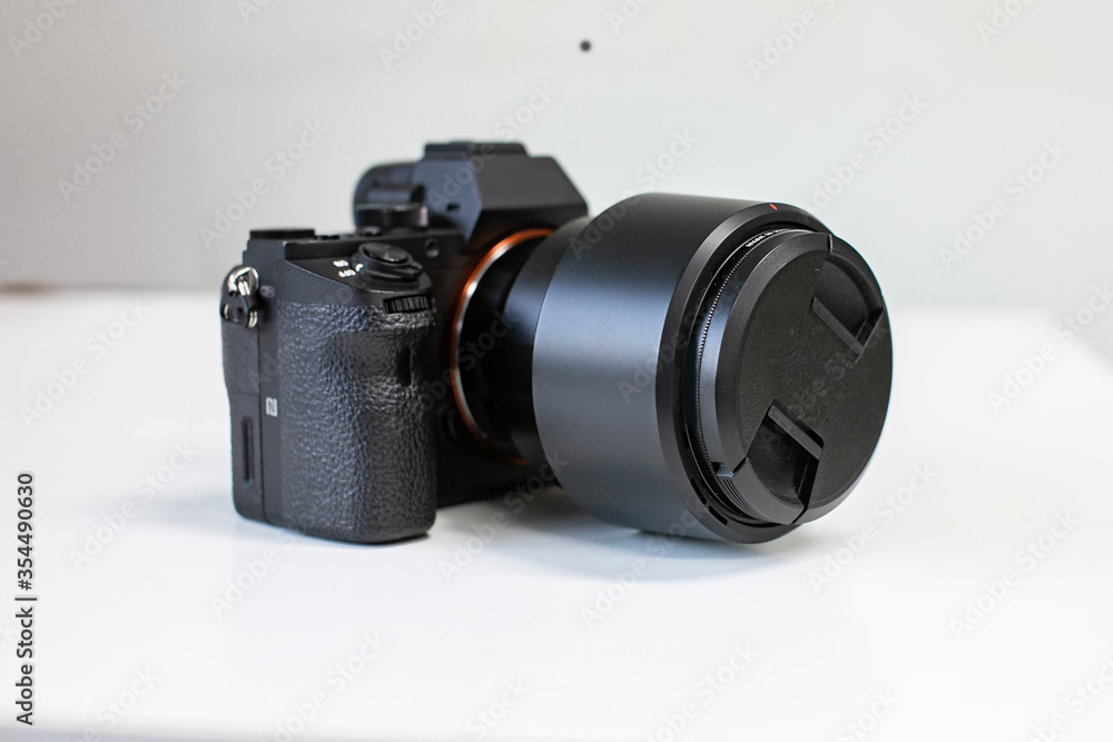 Blurry image Camera Mirrorless Full frame Placed on a white desk in a ...