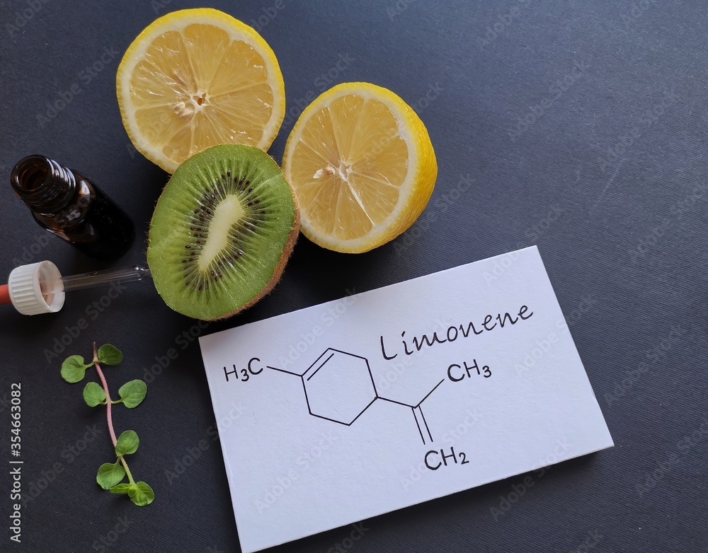 Structural chemical formula of limonene with fresh citrus fruit and a ...