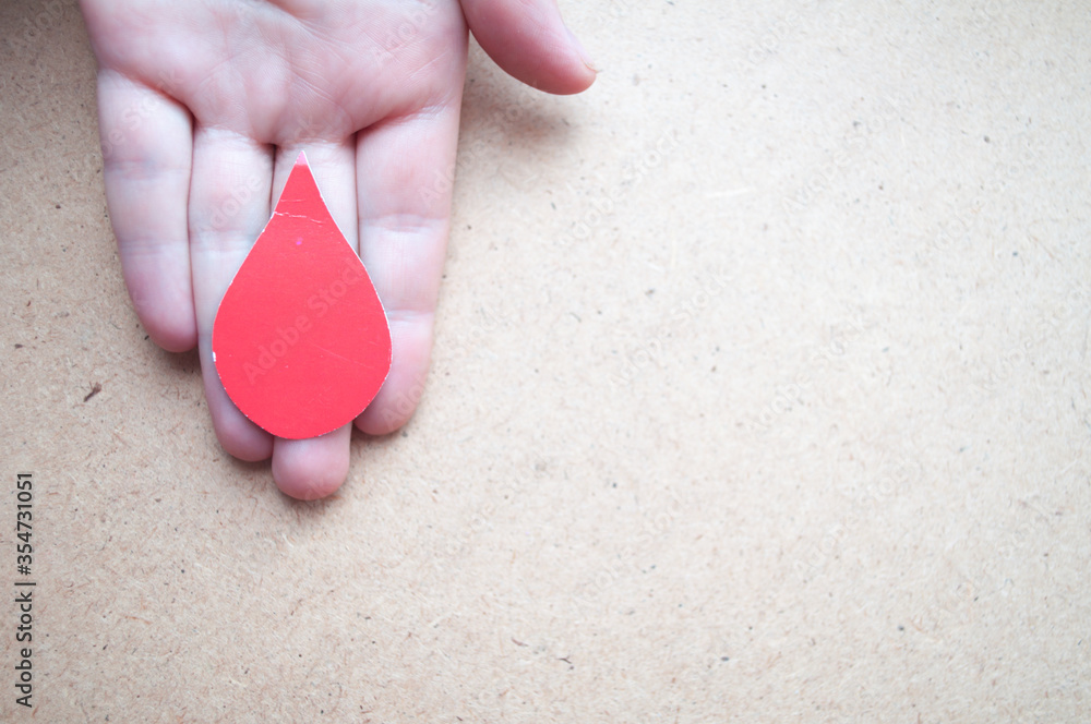 Hand holding blood drop, give blood donation, blood transfusion, world ...