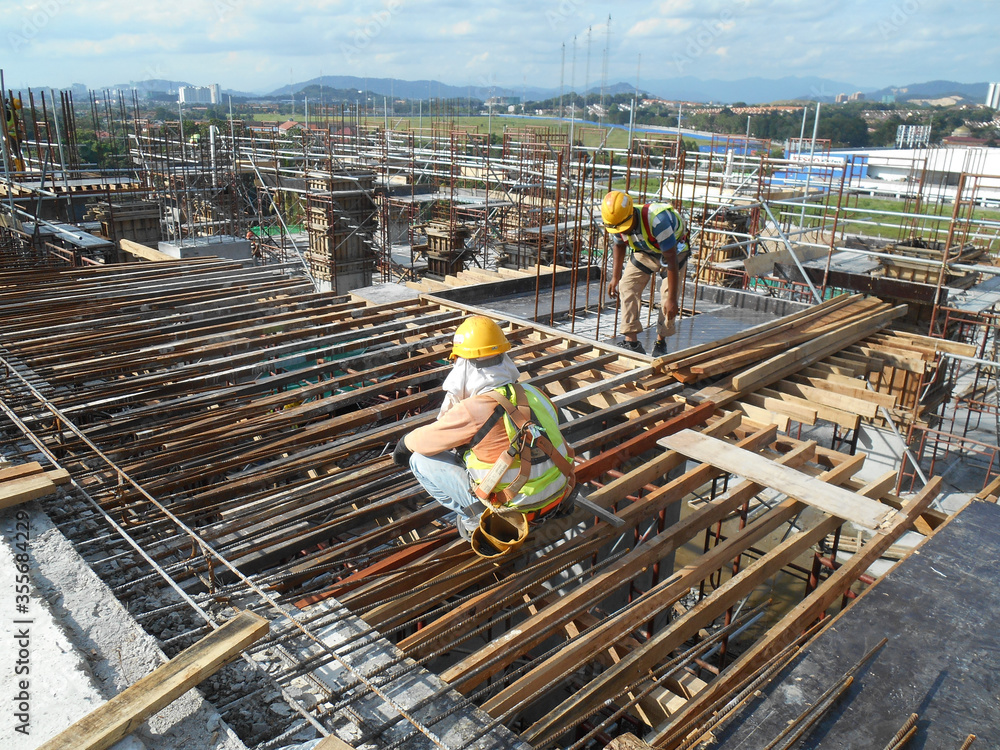 MALACCA, MALAYSIA -JULY 12, 2016: Construction workers fabricating ...