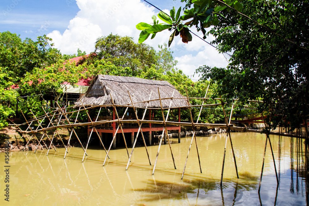 Poor cottage with arbour and a bridge in Mekong Delta, Vietnam Stock ...