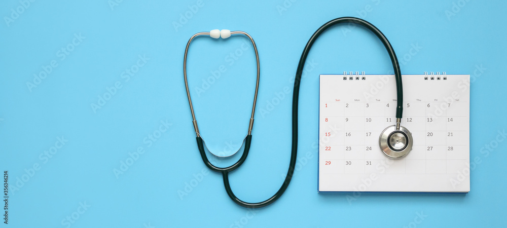 Stethoscope with calendar page date on blue background doctor ...
