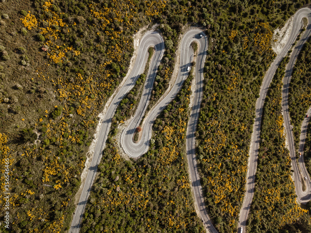 Foto de Stock Aerial photos around Crown Range winding road taken in ...
