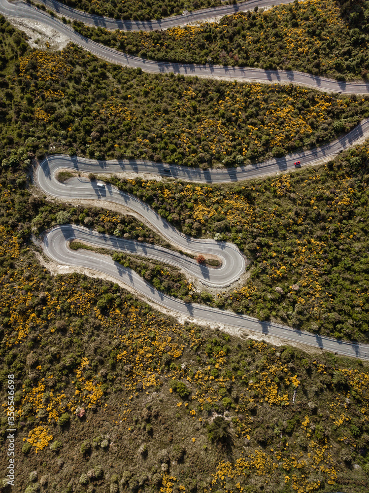 Foto de Stock Aerial photos around Crown Range winding road taken in ...