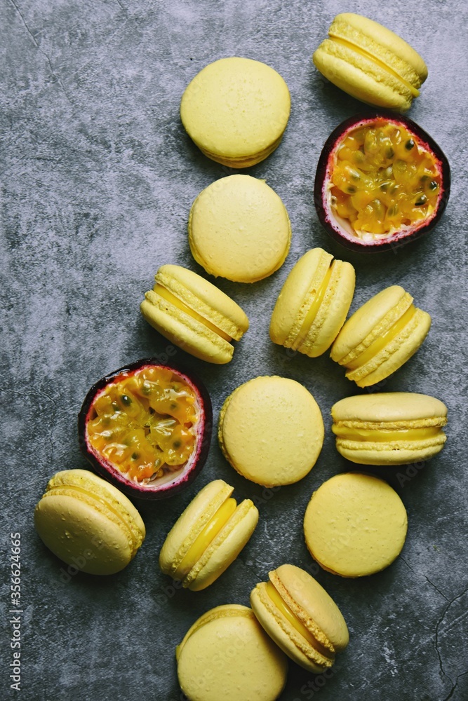 Passoin fruit and gorgonzola cheese macarons on the dark background ...