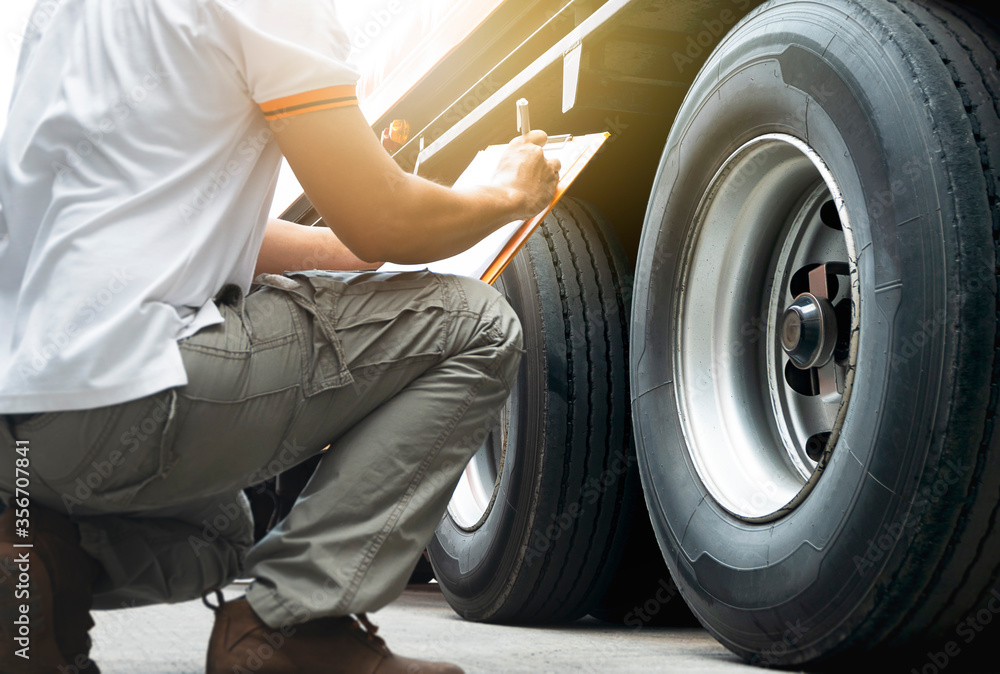 Auto Mechanic is Checking the Truck's Safety Maintenance Checklist ...