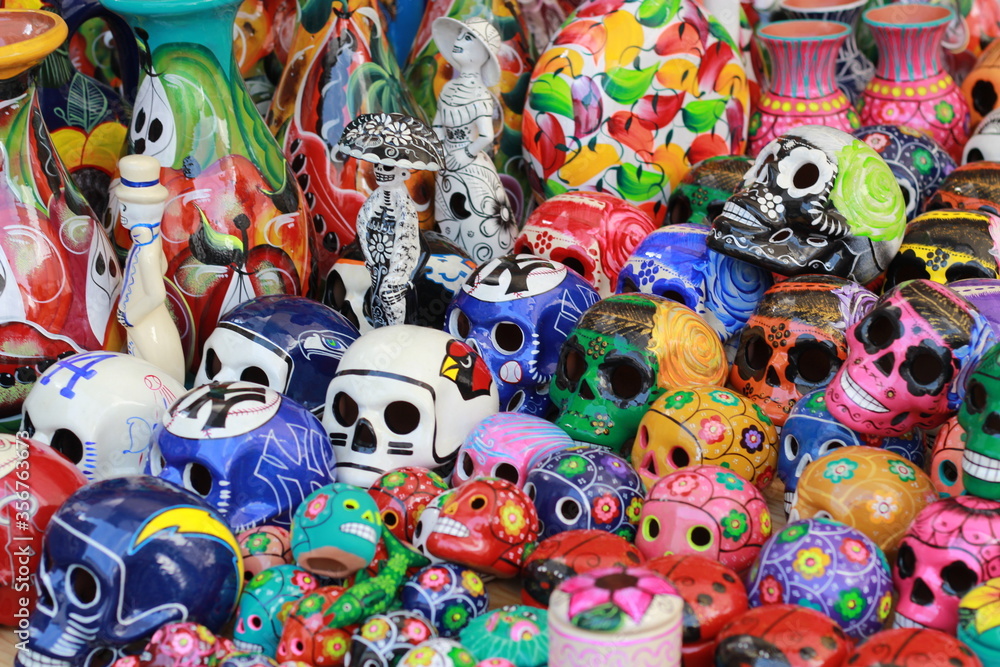 Mexican sweet bread, pan de muerto, papel picado and traditional skulls ...