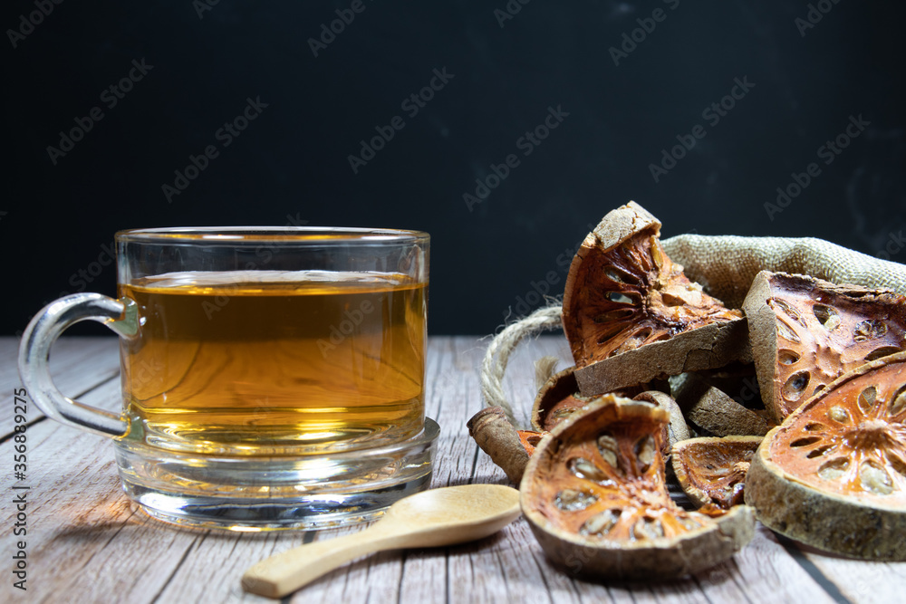 Dried Bael Fruit and Bael Fruit Juice in clear glass Place on the table ...