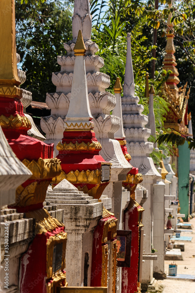 Collection of stupas and pagodas used as graves aligned along temple ...
