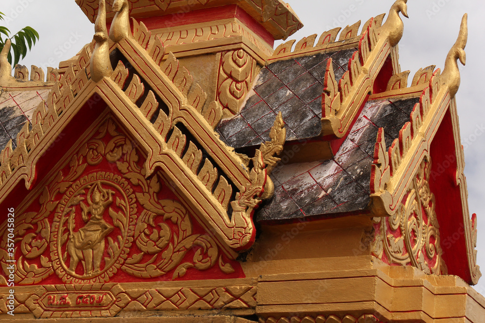 Pediment gabel and roof top architecture of buddhist design in a wat in ...