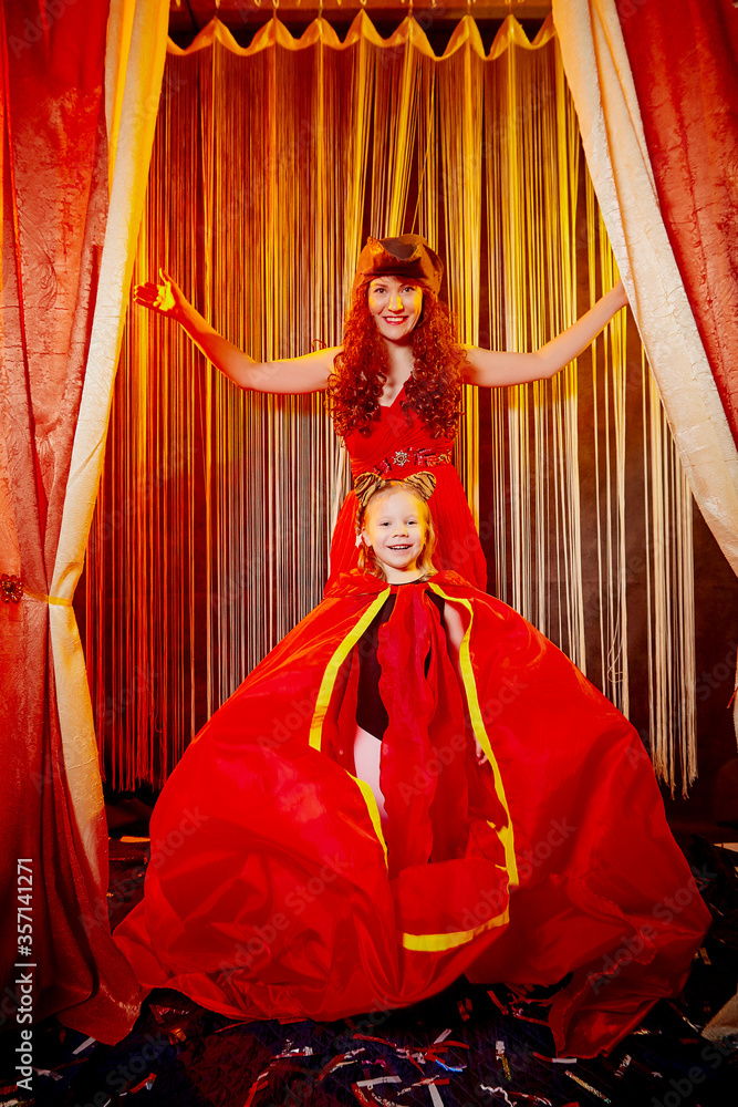 Family during a stylized theatrical circus photo shoot in a beautiful ...