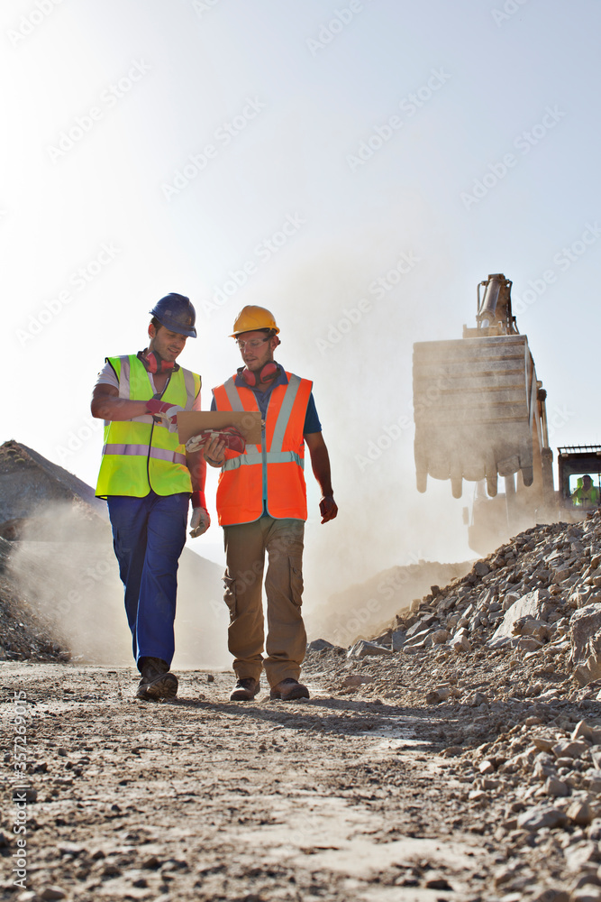 Workers talking in quarry Stock Photo | Adobe Stock
