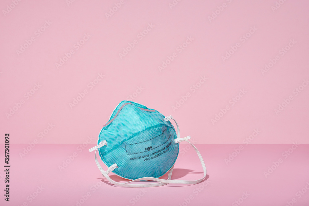 N95 Respiratory Particle Mask Still LIfe on Pink Surface and Background ...