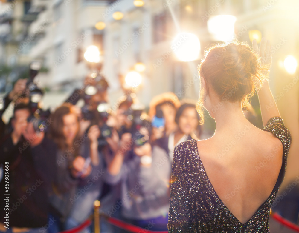 Celebrity waving at paparazzi photographers at event Stock Photo ...
