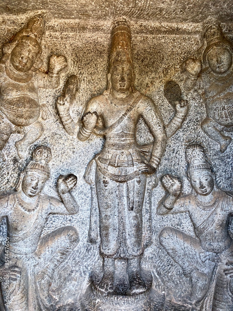 Bas relief rock cut sculptures of gods, people and animals are carved prominently in the ...