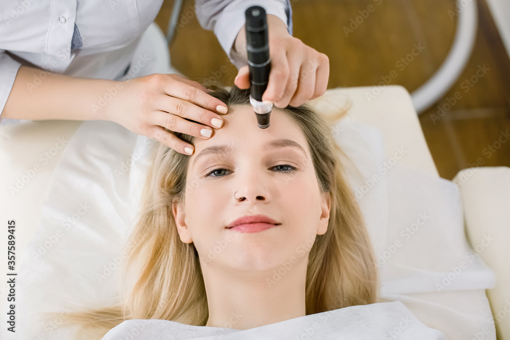 Dermatology and cosmetology clinic. Cropped top view of face of pretty ...