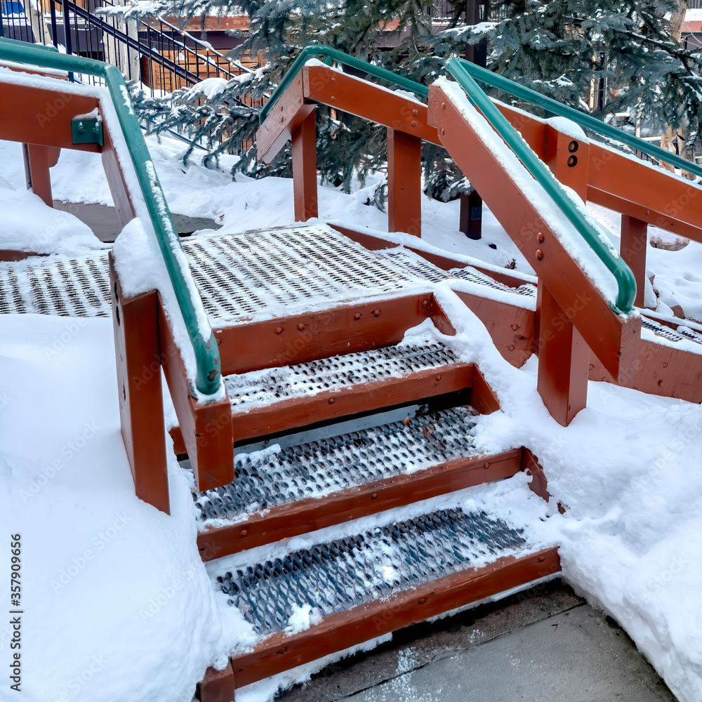 Square crop Stairs with green handrails and grate metal treads built on ...