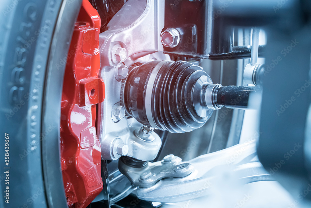 Elements of modern car front suspension. Control arm. Tie rod. Drive ...