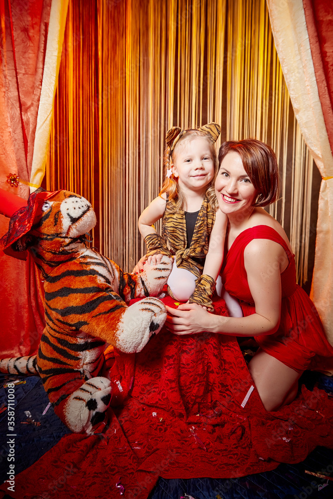 Family during a stylized theatrical circus photoshoot in a beautiful ...