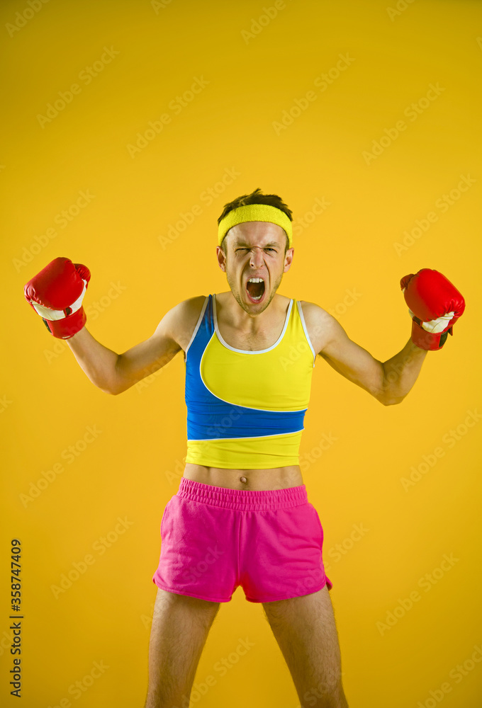 Screaming bearded sporty guy boxer sportsman in headband and girl`s ...