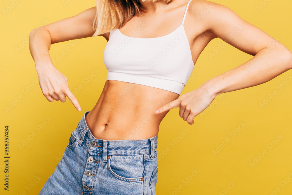 Picture concentrated on strong and slim abs muscles. Cut view of slim ...