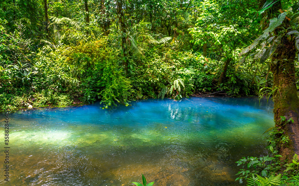 Rio Celeste with turquoise, blue water. Connection of two rivers and ...