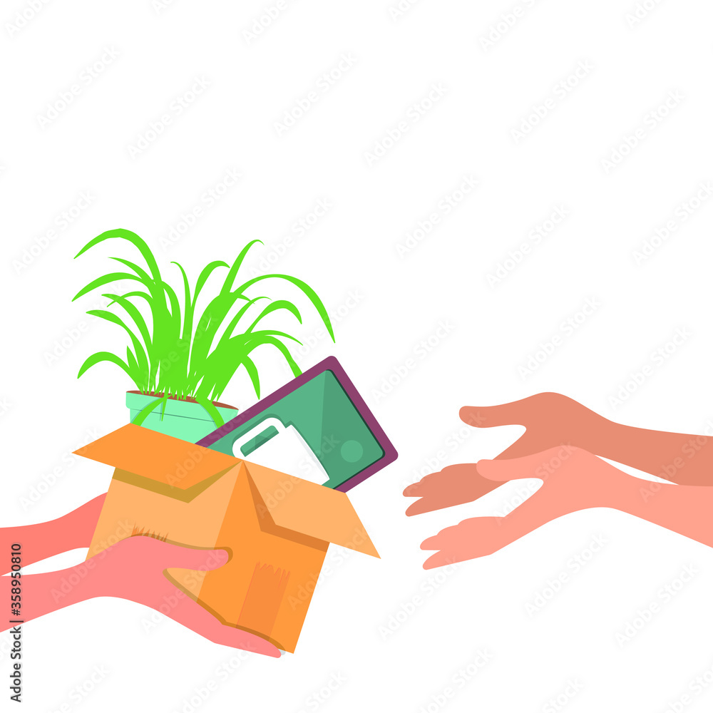 Cardboard box with personal belongings: houseplant, photograph, mug ...