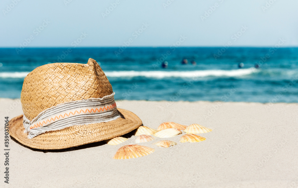 Vintage summer wicker straw beach hat on the beach near the sea. Stock ...