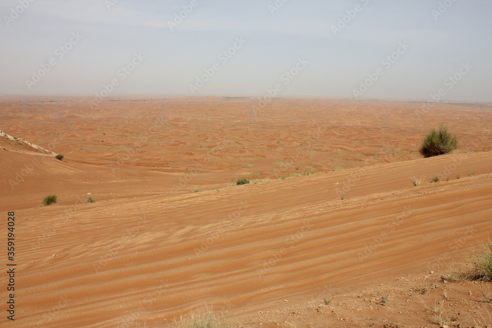 Hot and arid desert sand dunes terrain in Sharjah emirate in the United ...