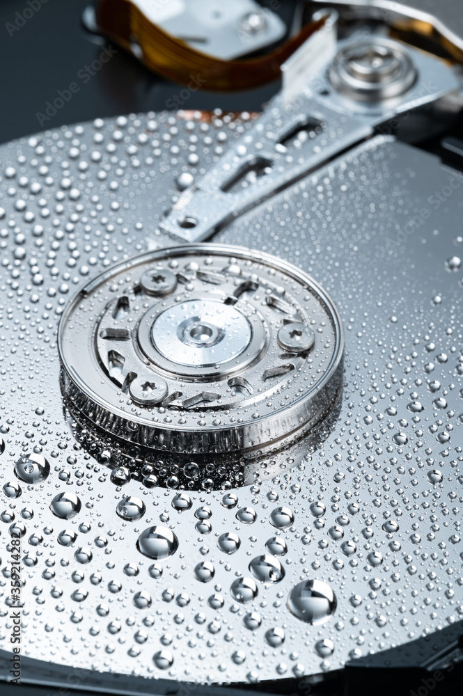 water drop on a damped hard disk Stock Photo | Adobe Stock