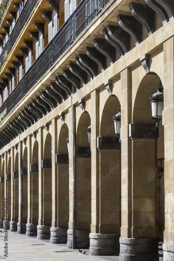 Columns with arches. Monumental stone structure. Strict lines in ...