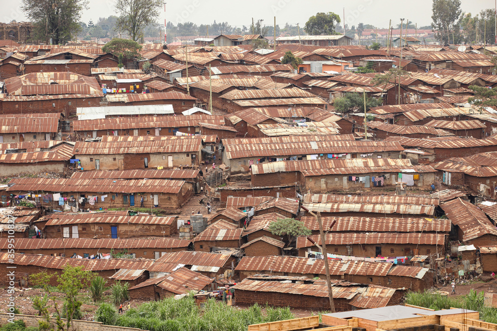 Corrgutead metal roofs with adobe walls makeup crowded and dirty slums ...