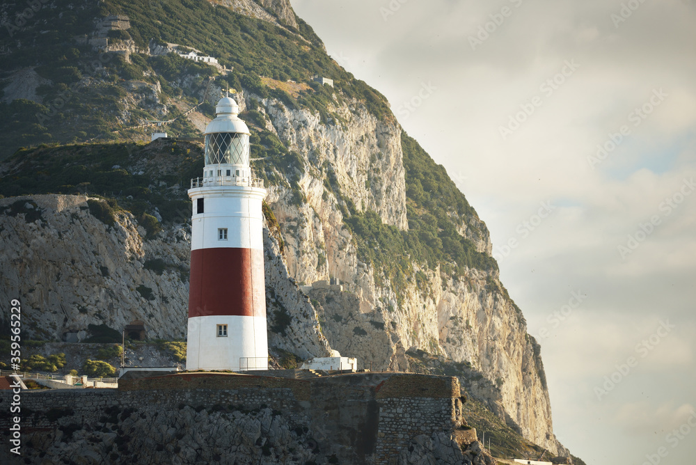 Trinity lighthouse at the rocky shore (cliffs) of the Europa Point ...
