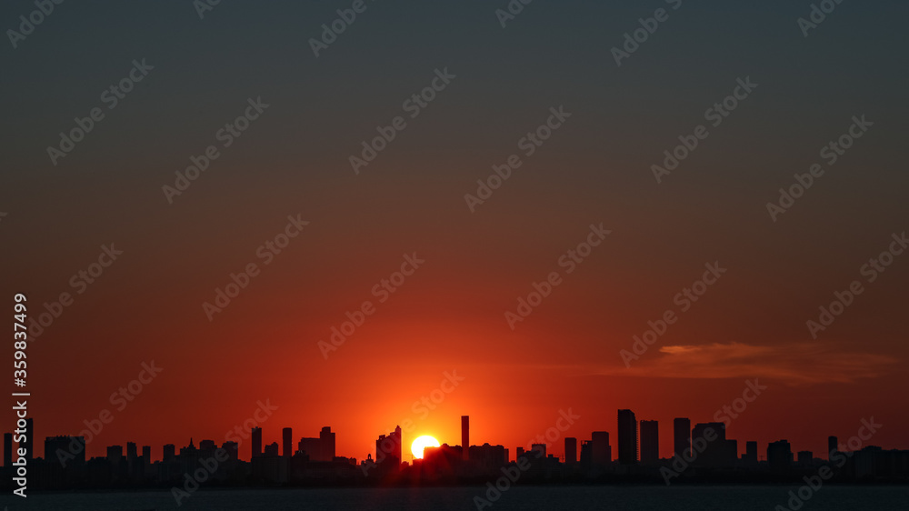 Breathtaking view of Miami skyline sunset. Sun between buildings. Taken ...