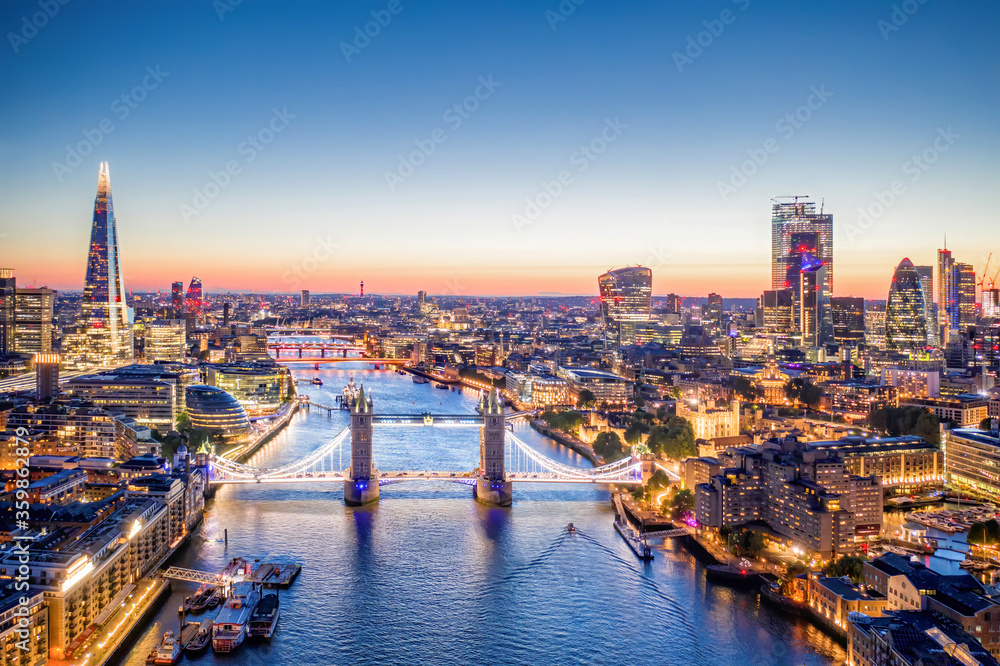 Aerial photograph of Tower Bridge and the River Thames at sunset ...