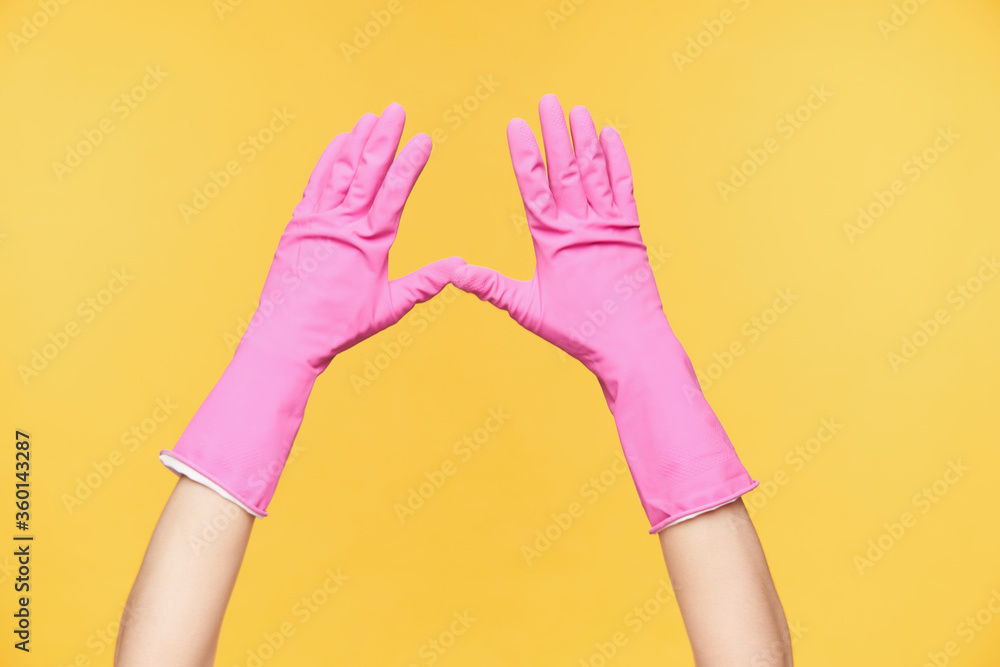 Horizontal photo of two hands in pink gloves being raised while posing ...