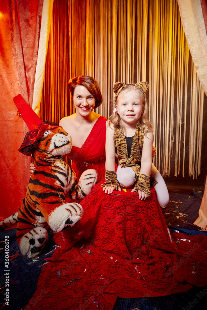 Family during a stylized theatrical circus photoshoot in a beautiful ...