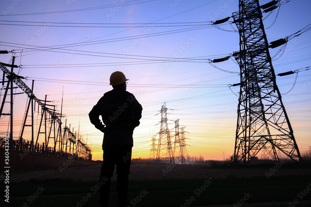 Electricity workers and pylon silhouette, Power workers at work Stock ...