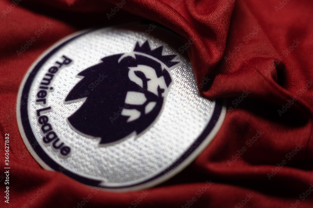 The logo of the new english premier league logo on red football jersey ...