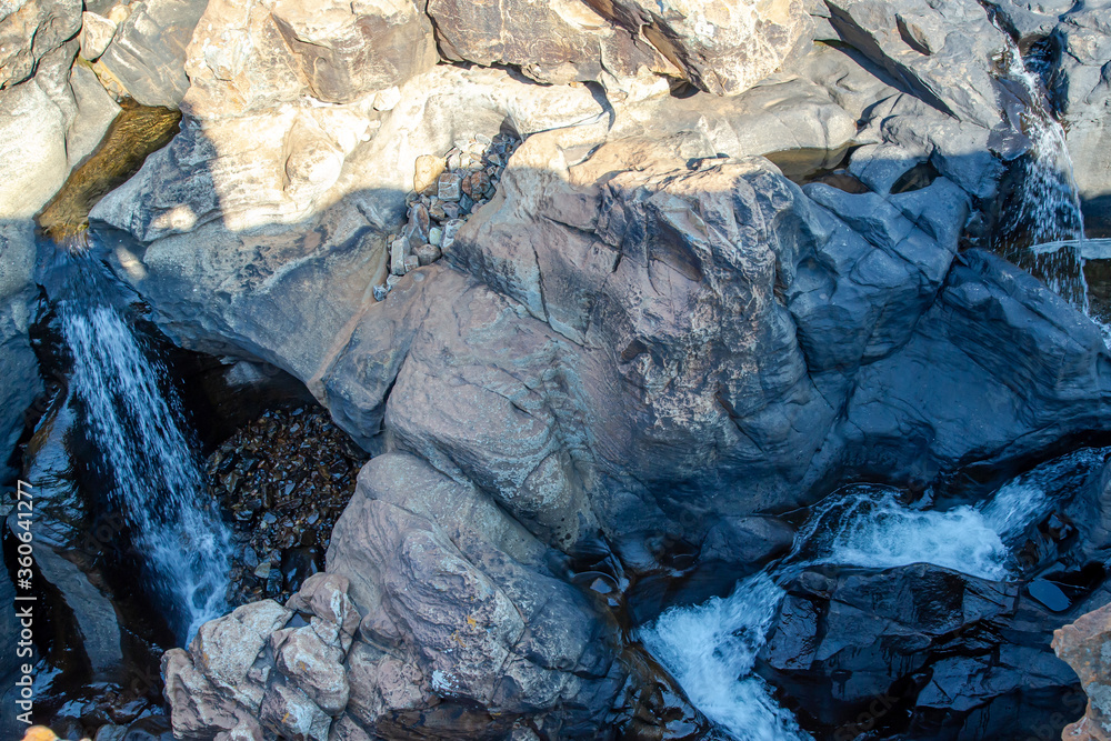 canyon with natural water potholes with clear mountain water and rocks ...