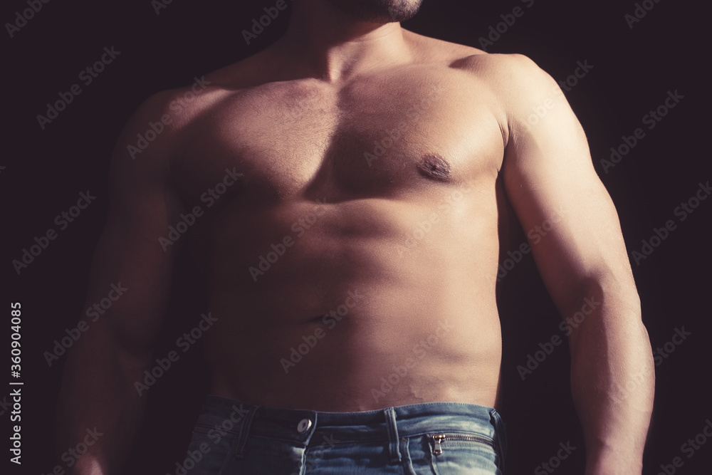 Strong bodybuilder with six pack, perfect abs, shoulders, biceps ...